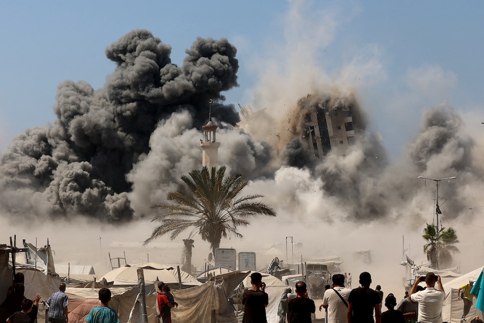 Israel levels Gaza high-rise tower near Palestinian civilian encampment ...