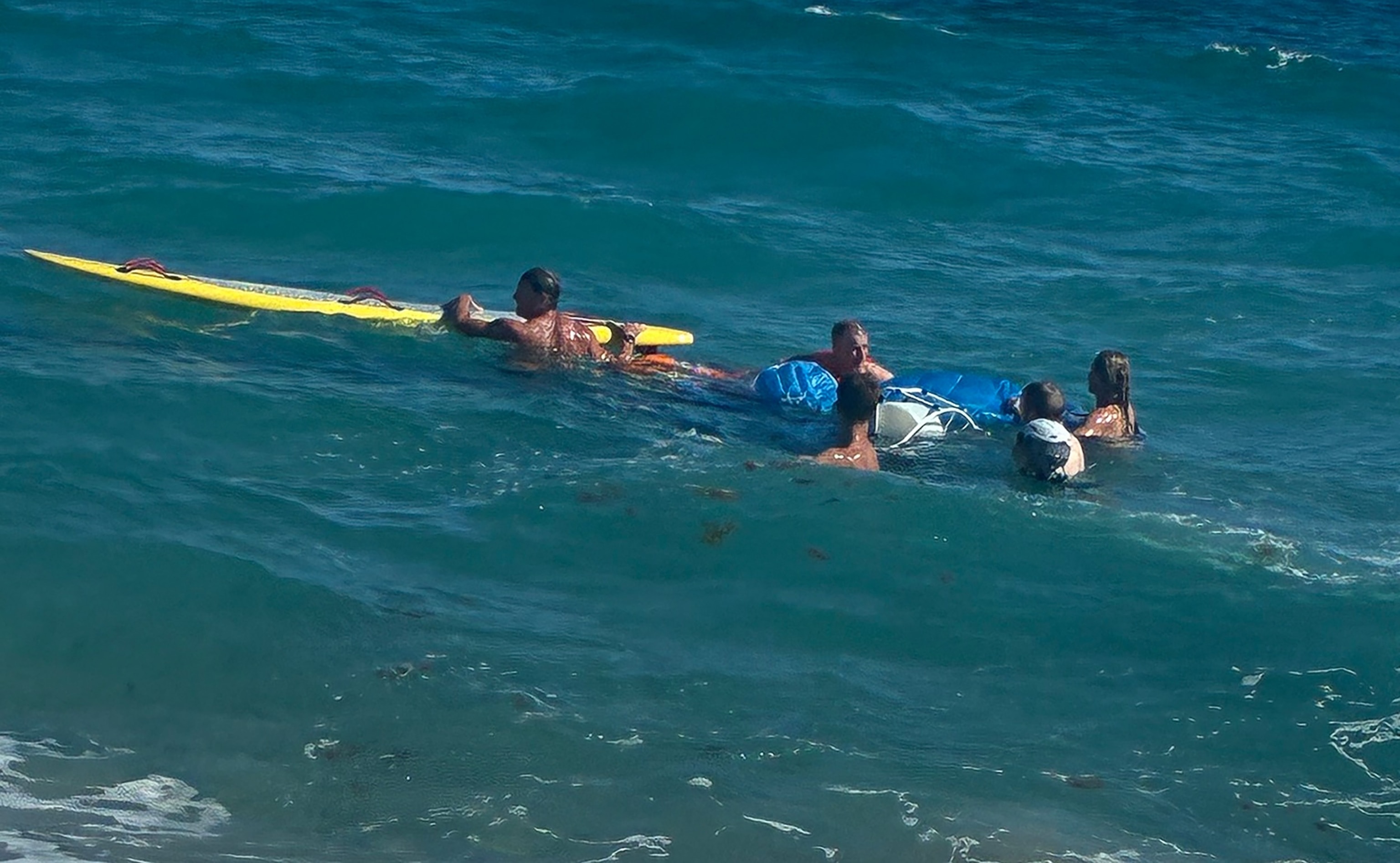 Lifeguards describe ocean rescue after paraglider falls 500 feet from ...