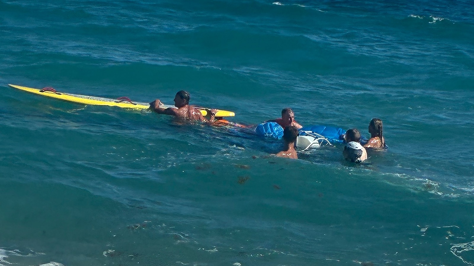 Lifeguards describe ocean rescue after paraglider falls 500 feet from ...