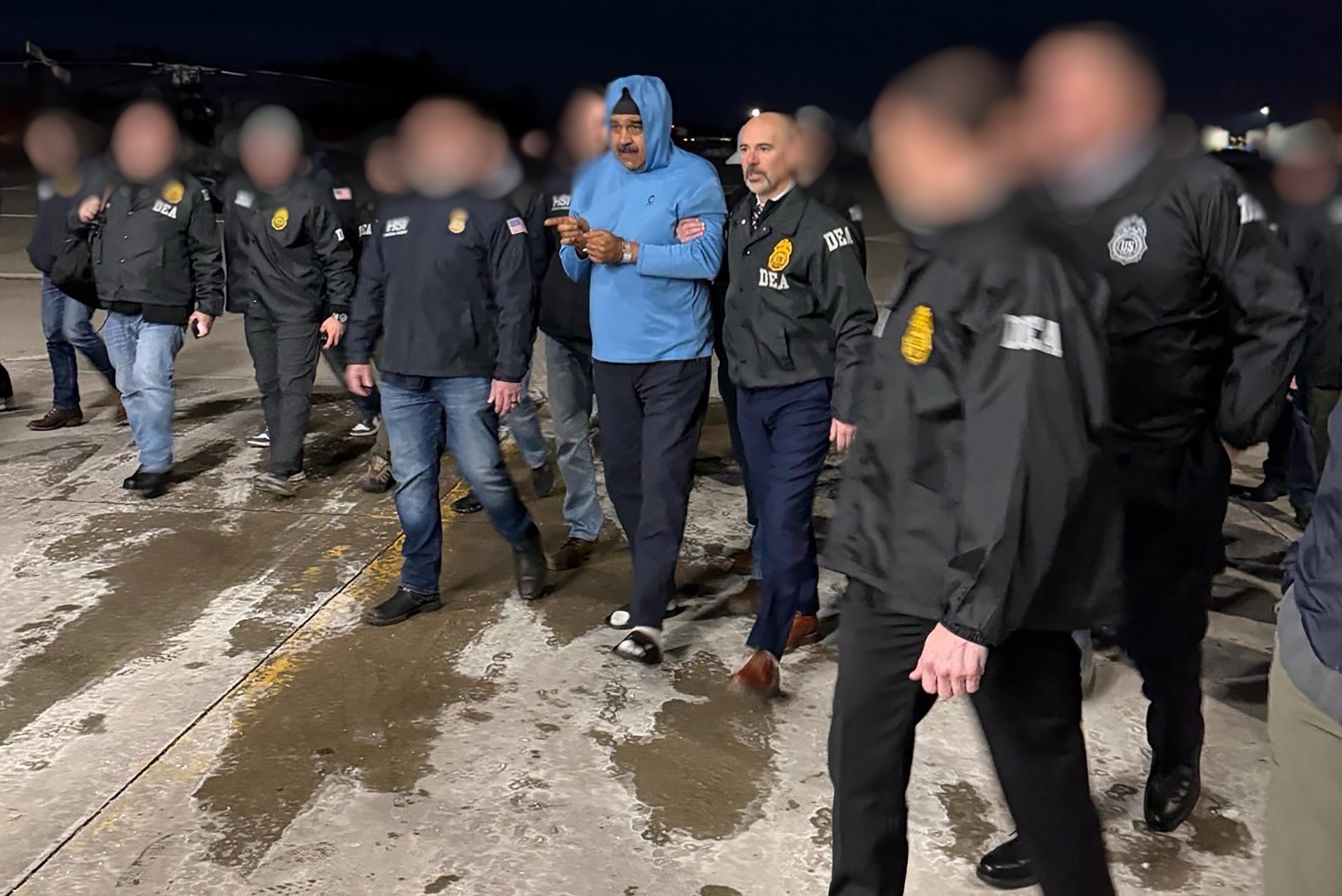 Venezuela live updates: Photos show handcuffed Maduro escorted by DEA ...