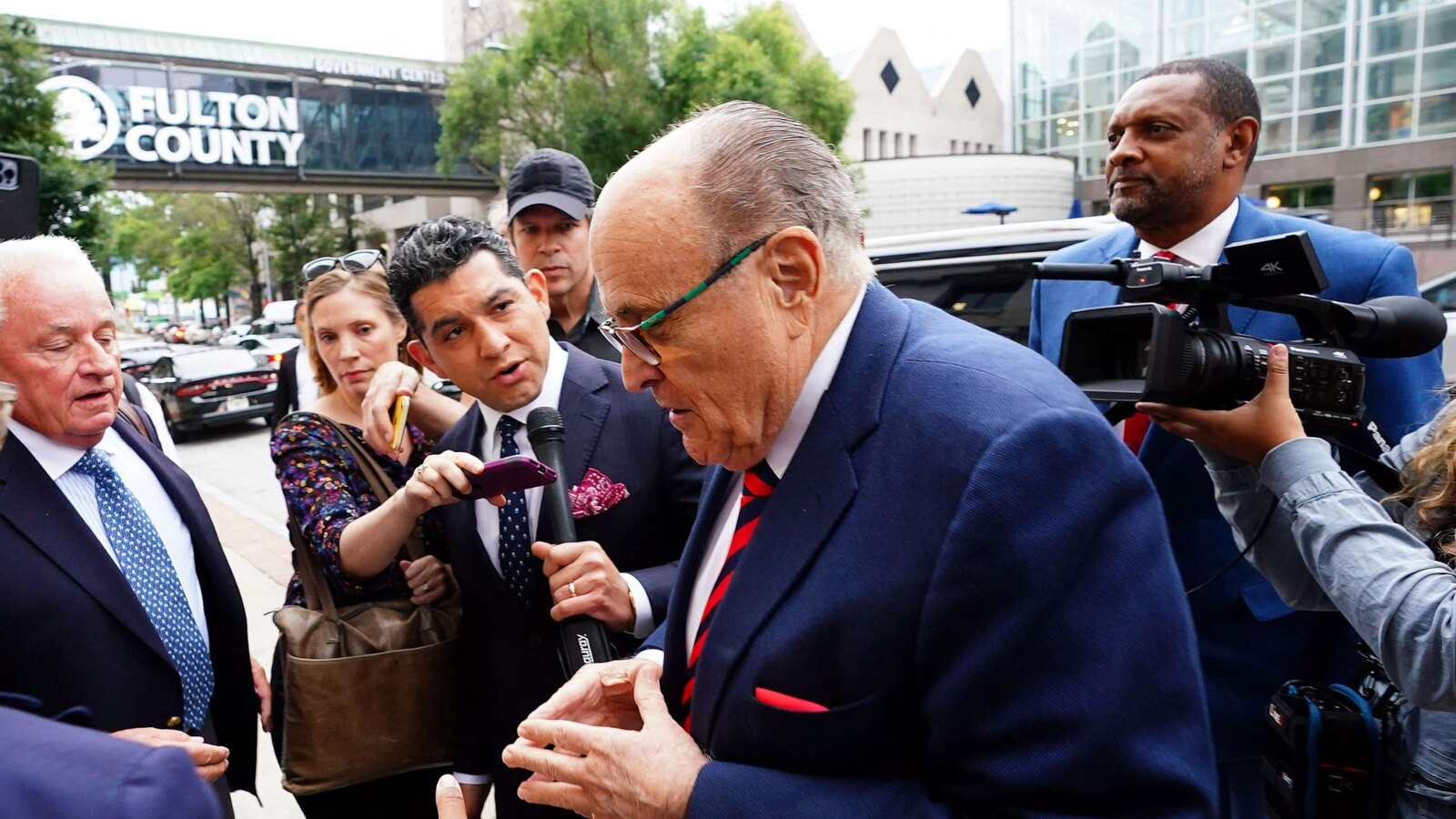 Judge sets trial date to decide how much Giuliani owes 2 election ...