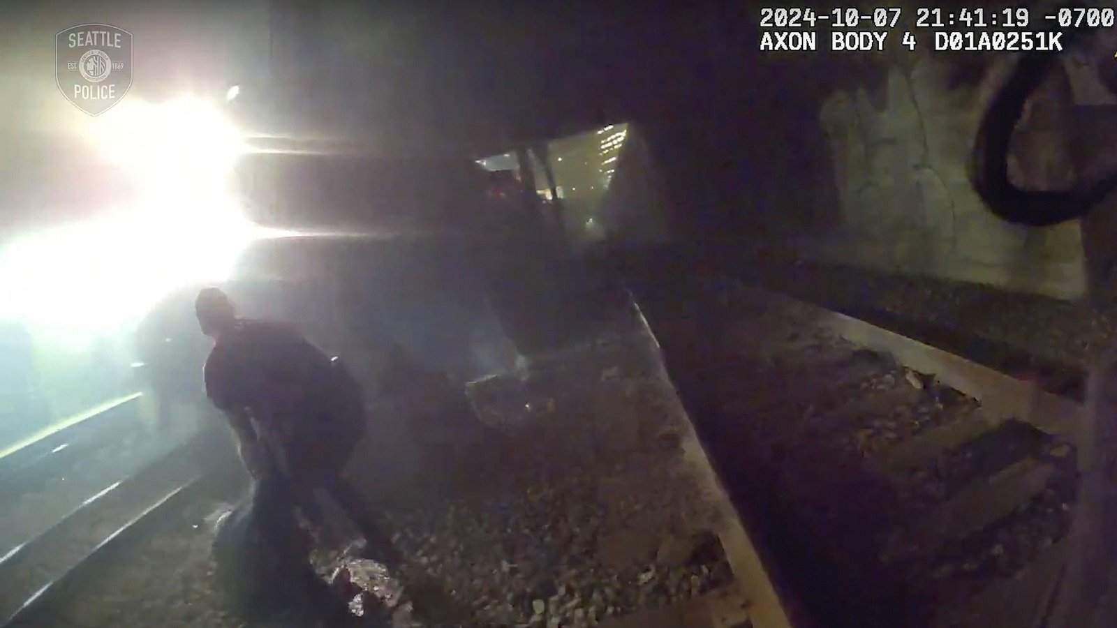 Dramatic video shows Seattle cop pulling injured man from tracks as ...