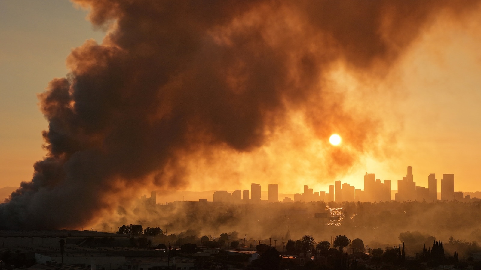 LA warehouse fire continues to burn as officials warn residents of air ...
