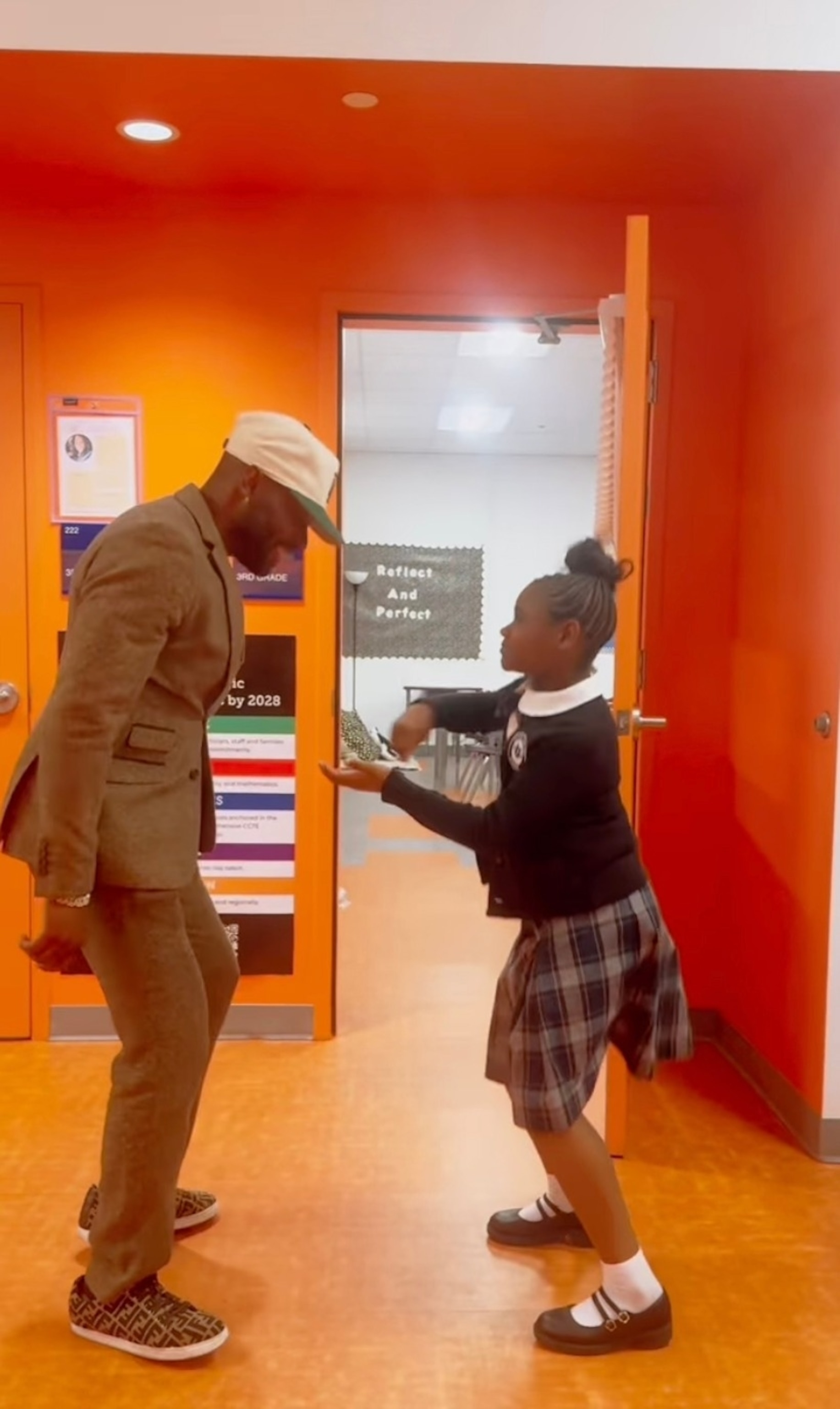 Teacher shares viral handshakes with students after returning to ...