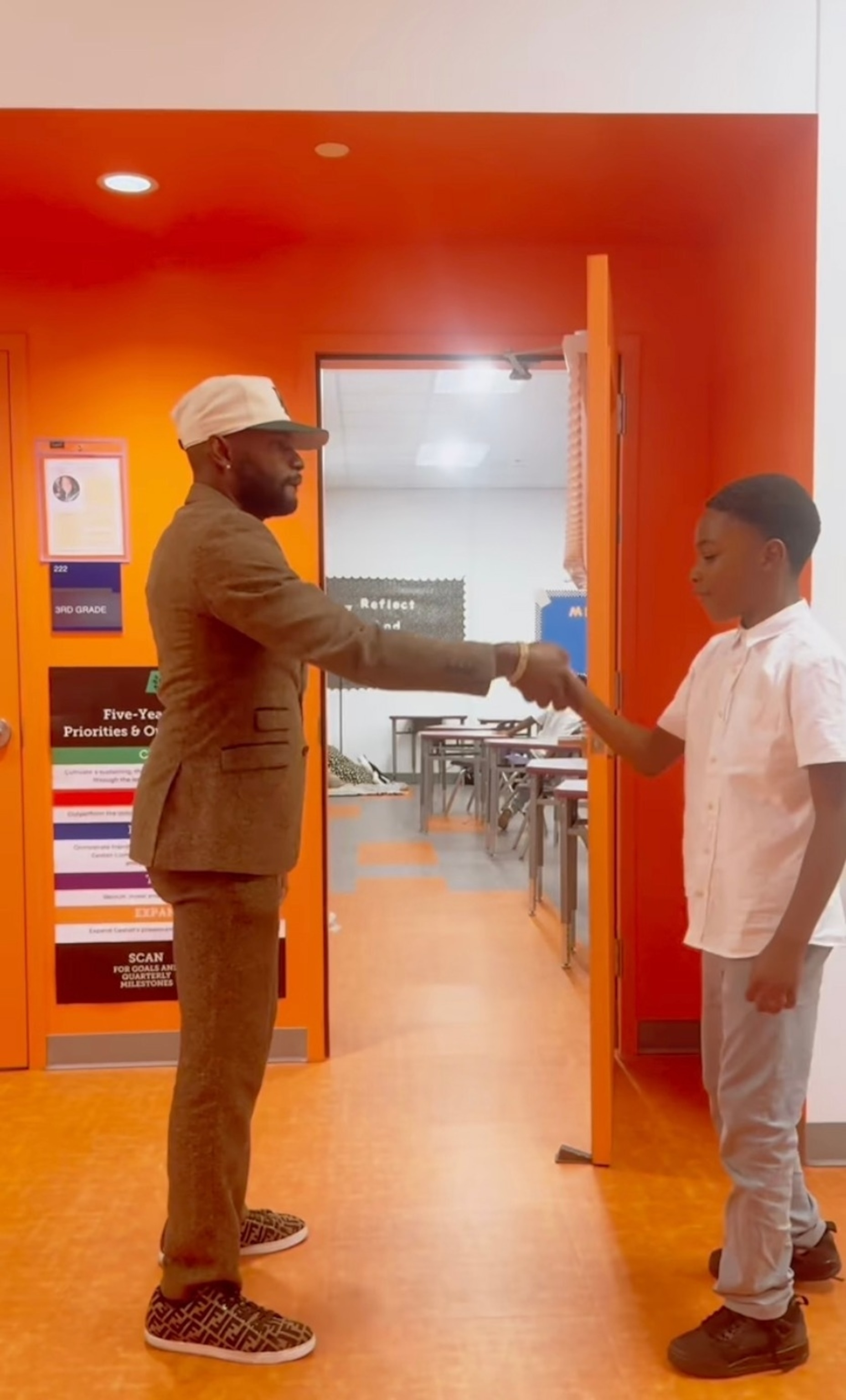 Teacher shares viral handshakes with students after returning to ...