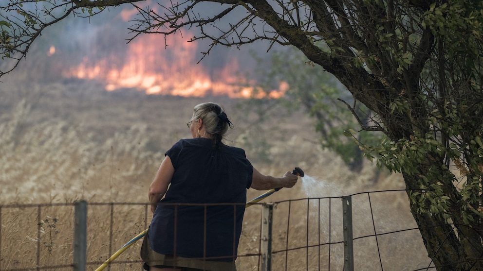 1 dead, 11 injured as 1,500 firefighters battle raging wildfires in ...