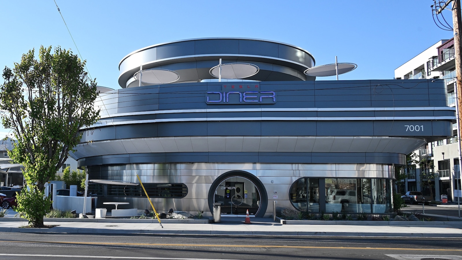 Inside Tesla's new Hollywood diner: Roller skating servers, electric ...