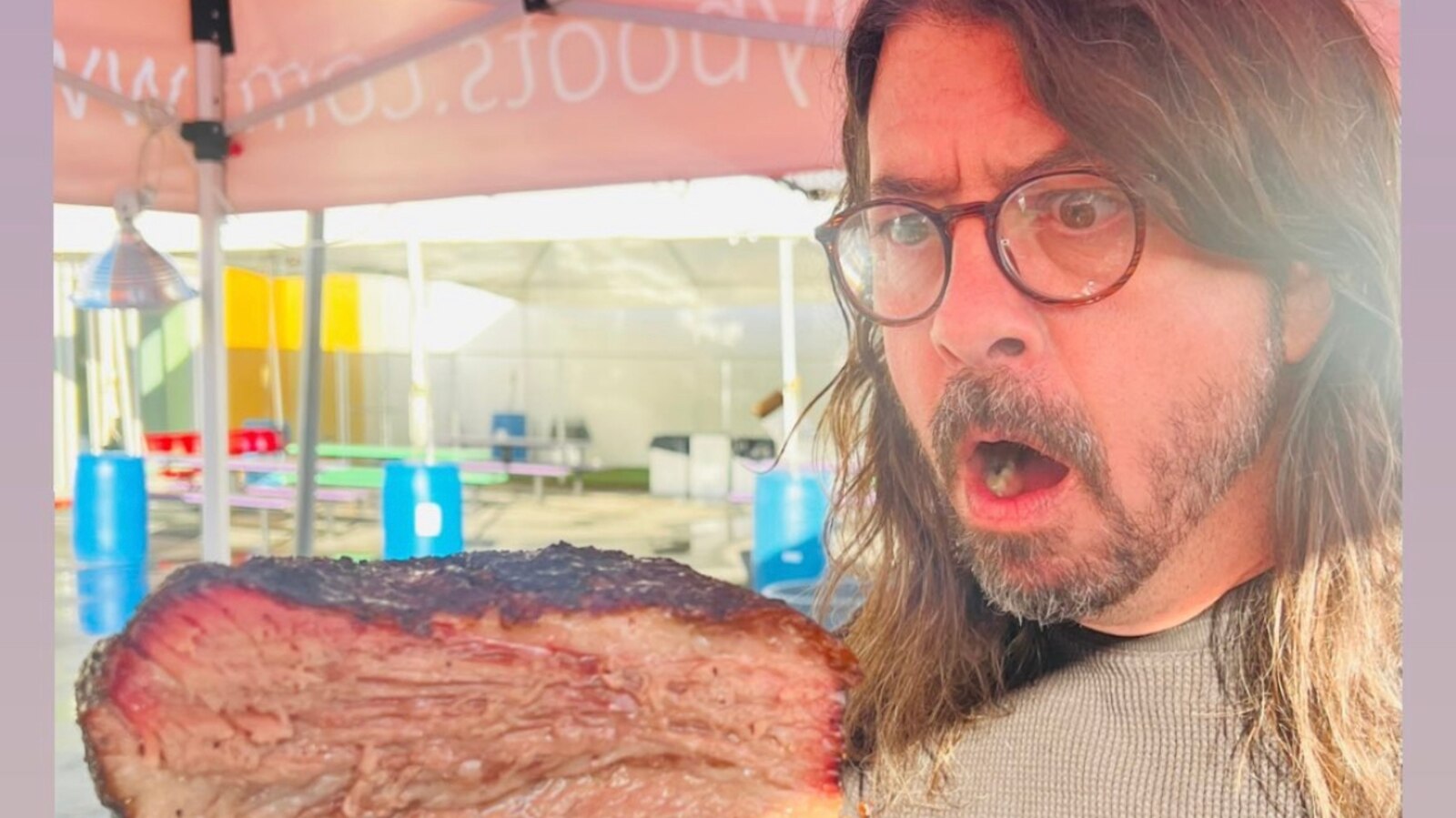 Dave Grohl smokes barbecue during storm to help feed 450 homeless ...