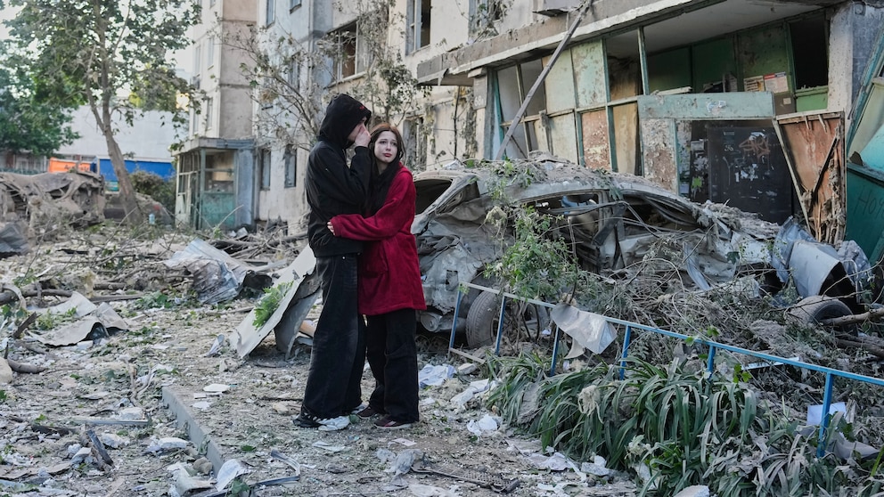Russian attack on Ukraine kills at least 11 and traps others in damaged ...