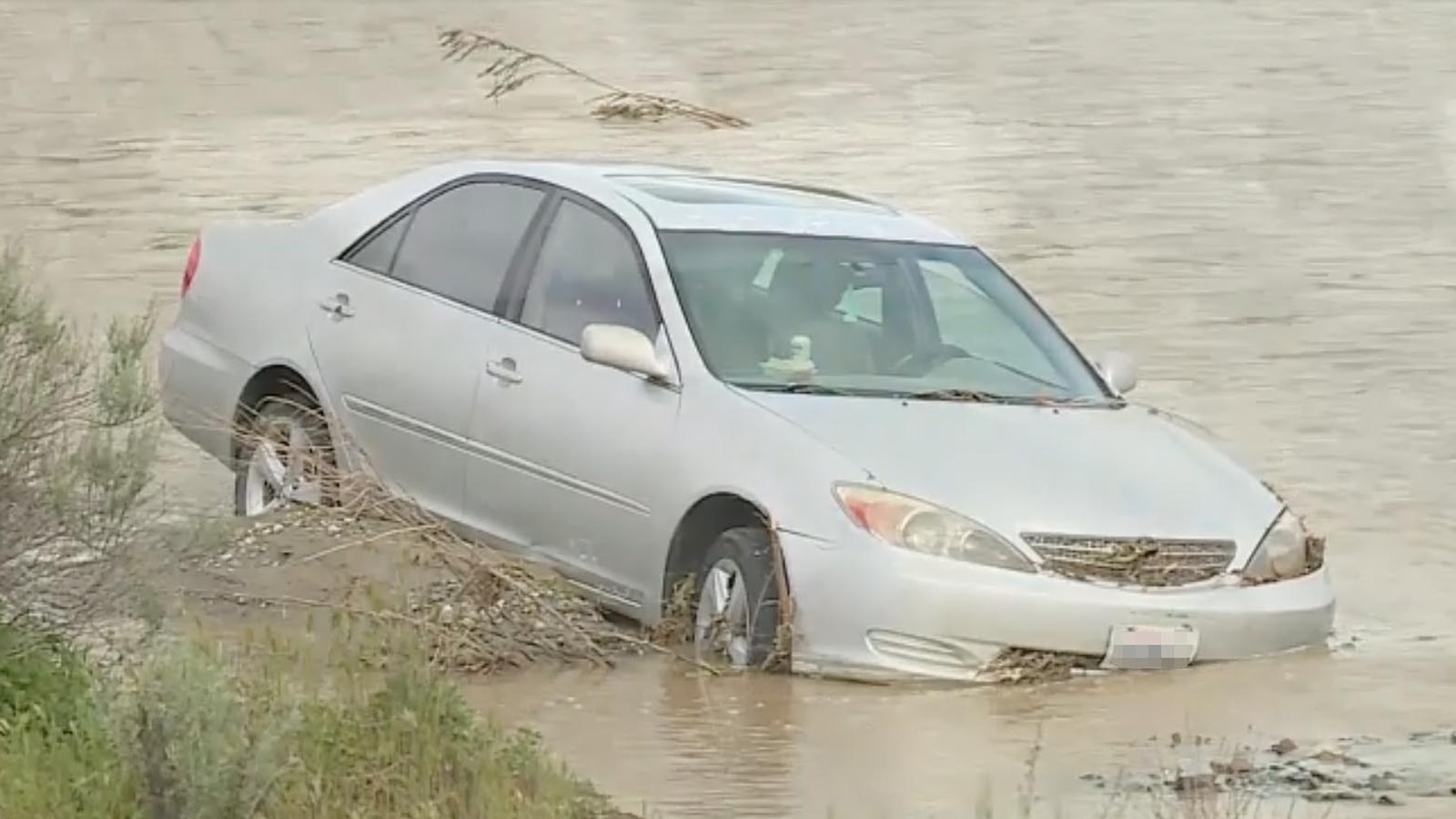 Man who allegedly tried to drive through flooded river crossing ...