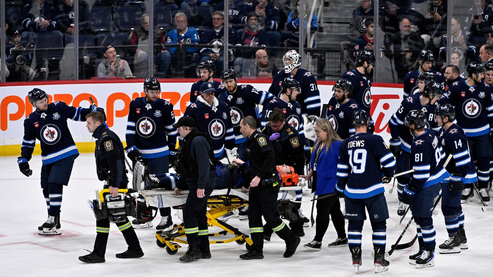 Jets D Fleury alert, moving extremities after taken off ice on ...