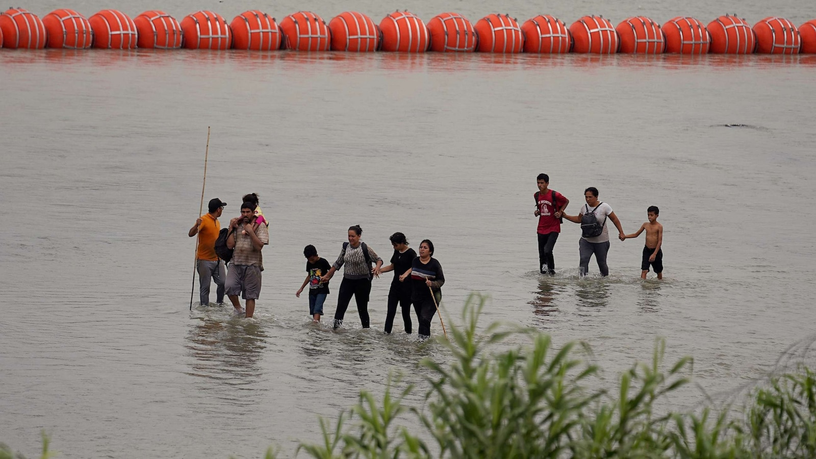 DOJ sues Texas and Gov. Abbott over use of buoys in Rio Grande to stop ...