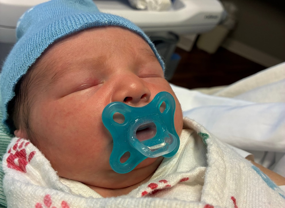 Woman shocked to welcome baby after experiencing stomach pain on ...