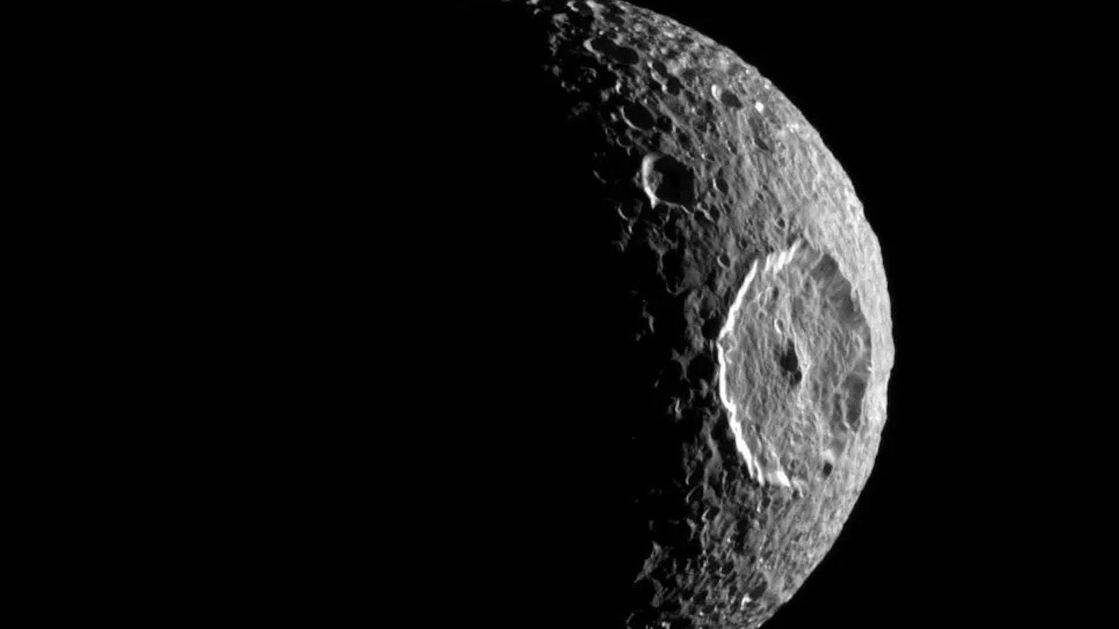 Saturn's 'Death Star' moon has a hidden ocean under its surface ...
