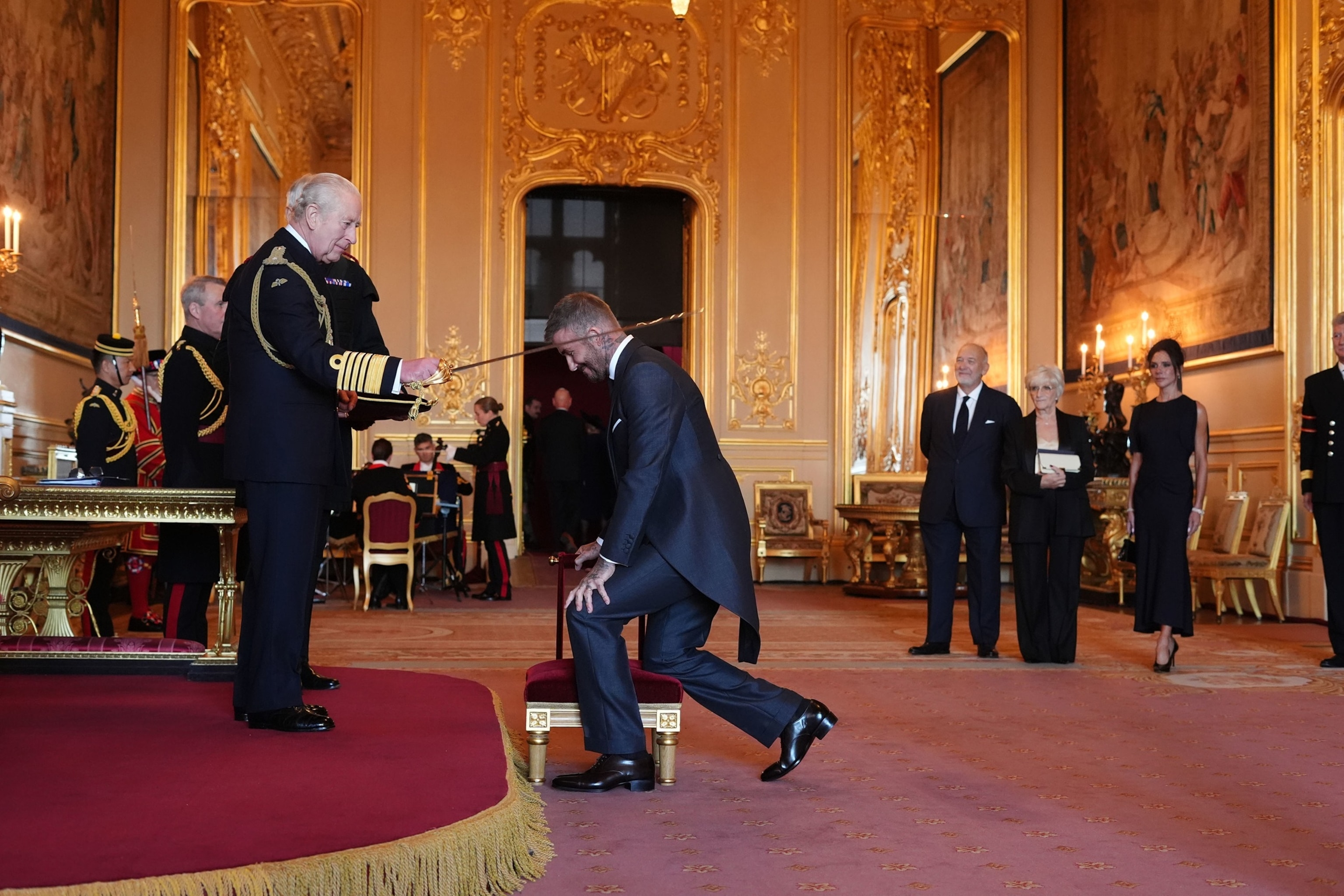 David Beckham knighted by King Charles III at Windsor Castle - ABC News