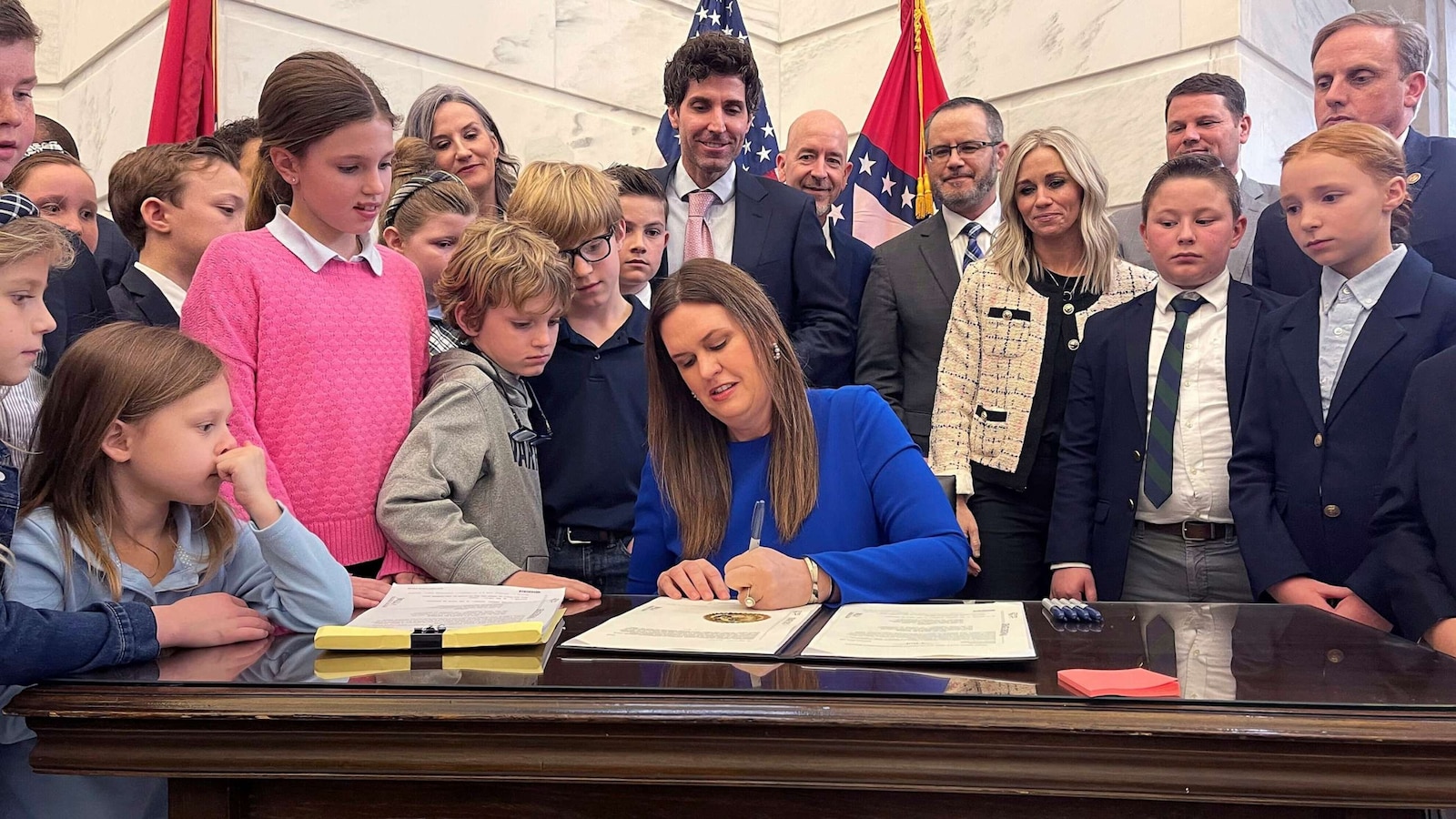 Sarah Huckabee Sanders Signs Sweeping Education Bill To Praise And