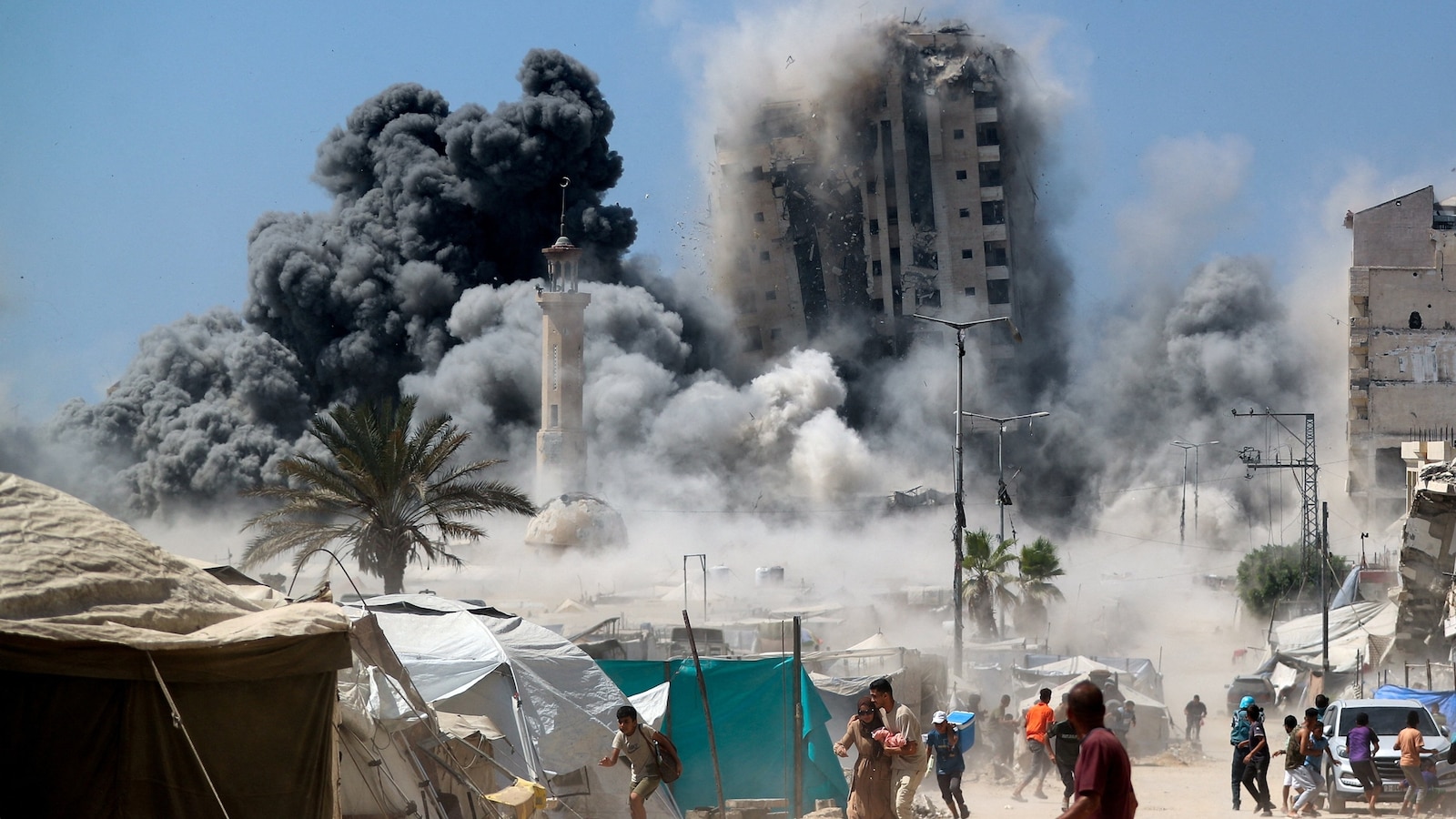 Israel levels Gaza high-rise tower near Palestinian civilian encampment ...