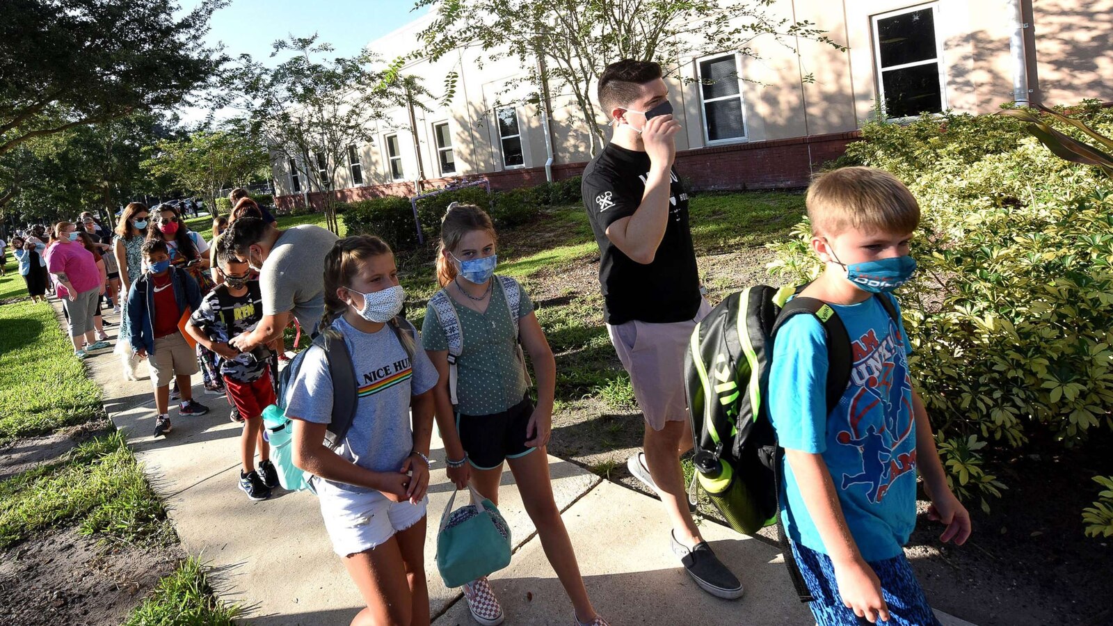 Officials urge mask-wearing as ‘tripledemic’ grows: What parents should ...